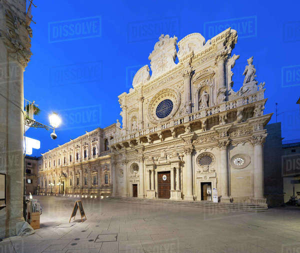 Baroque facade of Basilica di Santa Croce floodlit in evening, Lecce ...