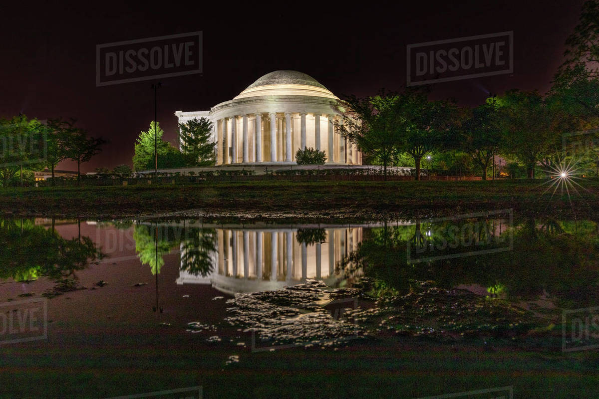 A night view of the Thomas Jefferson Memorial, lit up at night in West ...