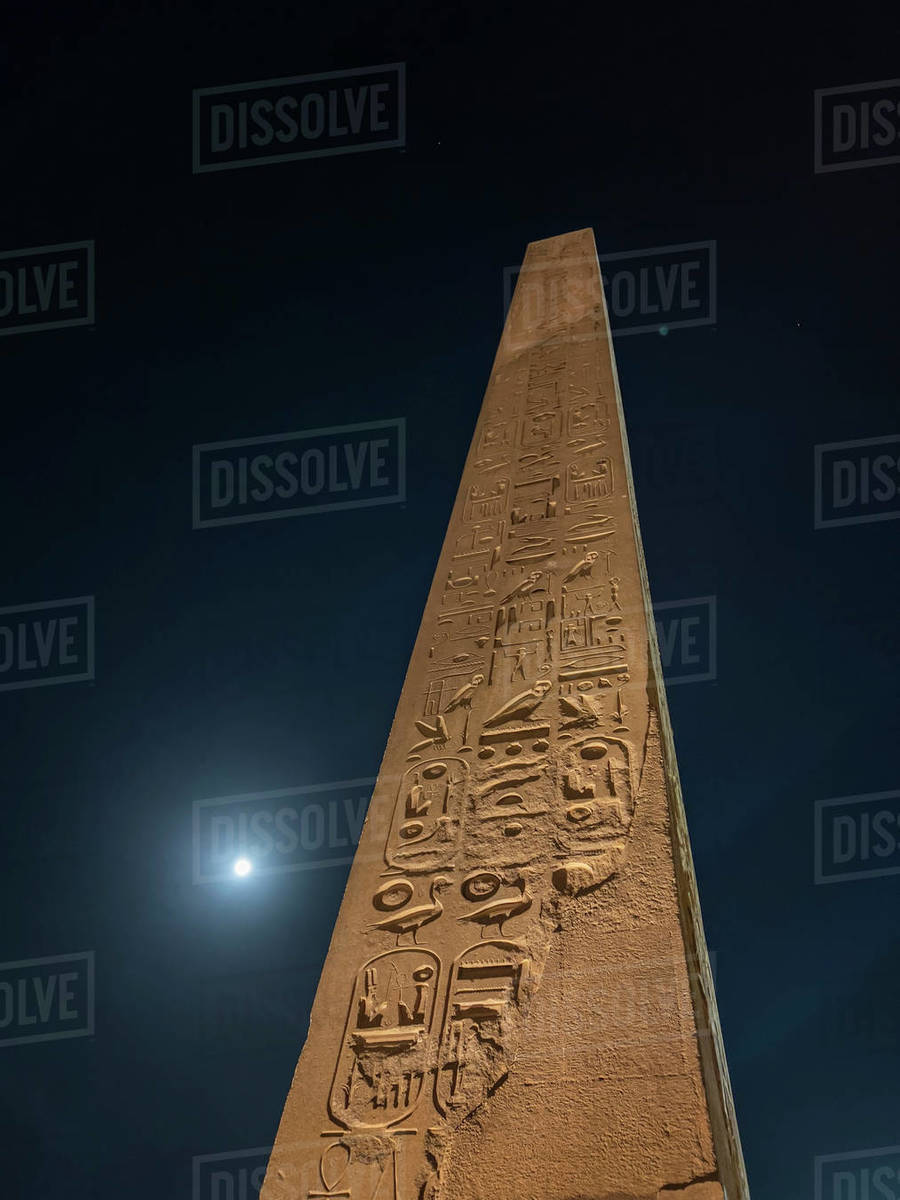 Obelisk at the Luxor Temple, at night under a full moon, constructed ...