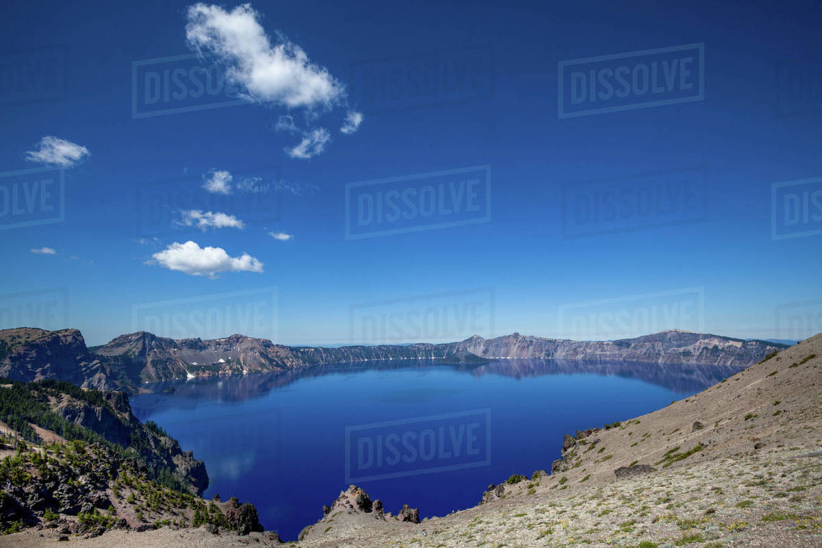 The still waters of Crater Lake, the deepest lake in the U.S.A., part ...