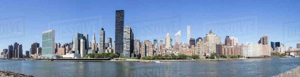 Panoramic skyline of Manhattan including UN, Empire State Building and ...