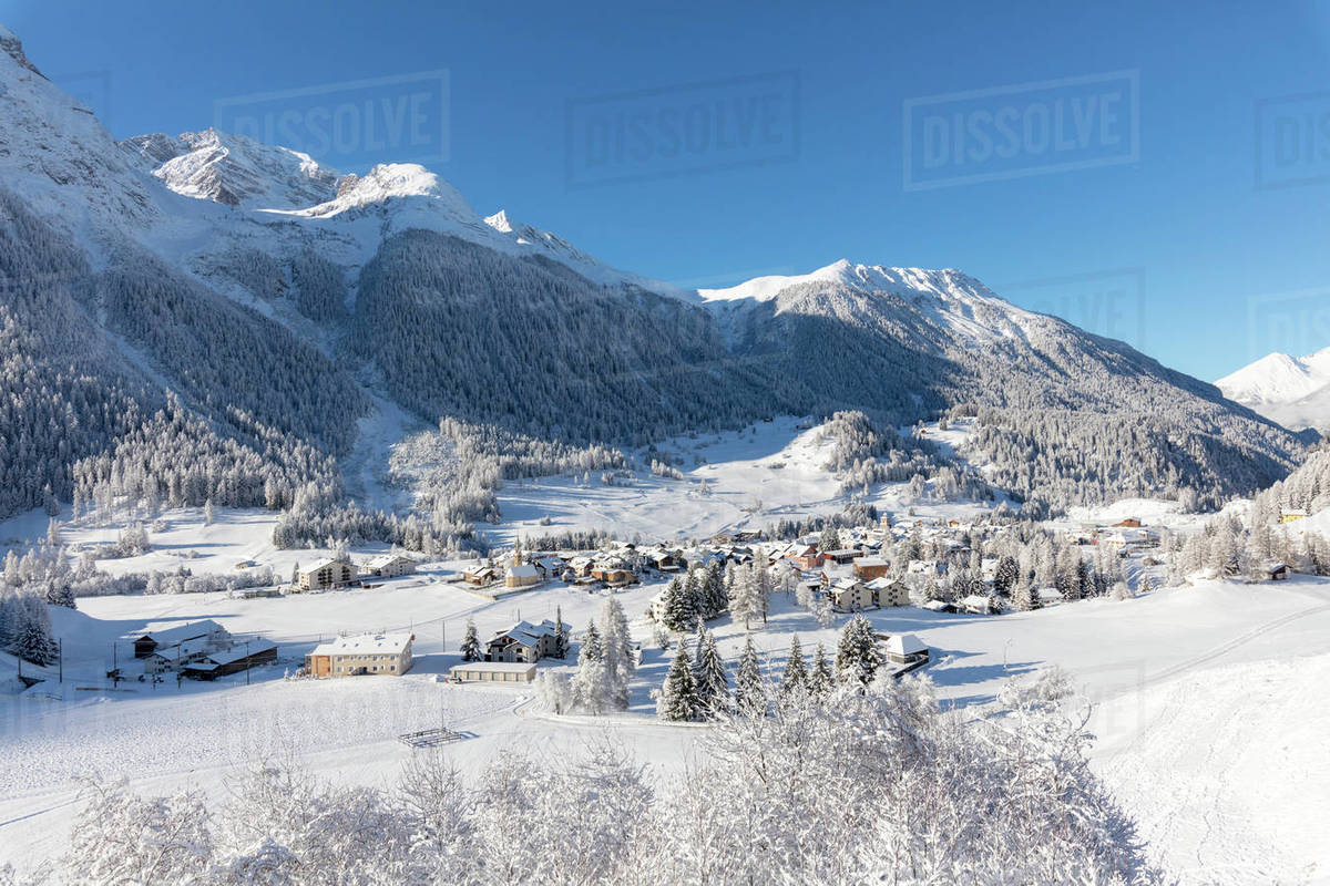 Alpine village of Bergun covered with snow, Albula Valley, Canton of ...