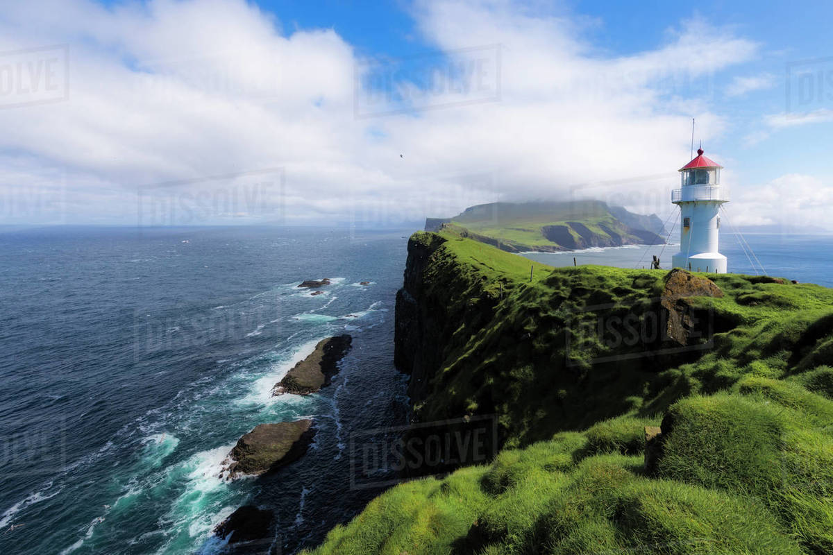 Lighthouse on islet known as Mykines Holmur, Mykines Island, Faroe ...