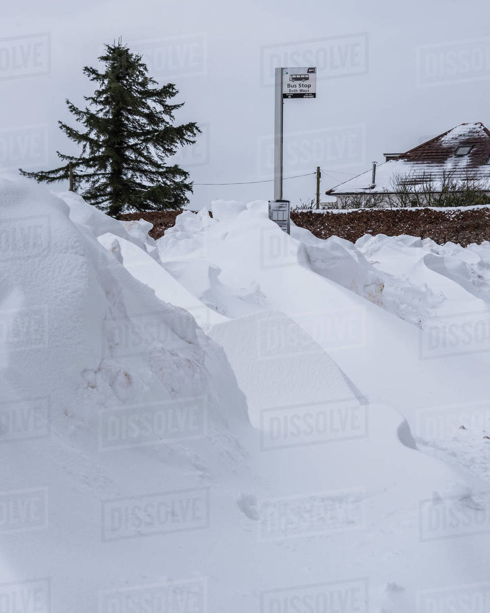 Snow drifts at a bus stop on the edge of Lennoxtown, at the foot of the ...