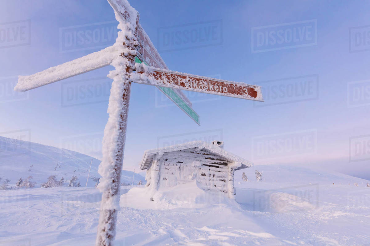 Frozen signage and wood hut, Pallas-Yllastunturi National Park, Muonio ...
