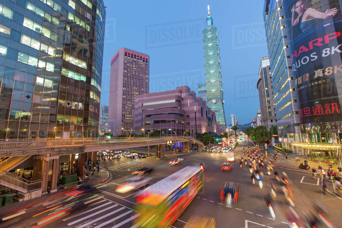 Traffic in front of Taipei 101 at a busy downtown intersection in the ...