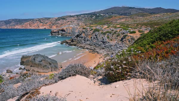 4K view of cute Praia do Abano tourism beach surrounded by sandy dunes ...