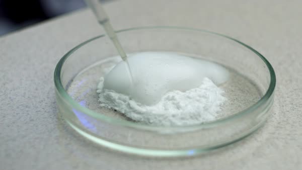 Science, chemistry and people concept - close up of scientists hands ...