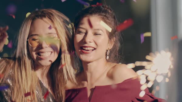 Close up couple of young multiracial girls wearing plush dresses ...