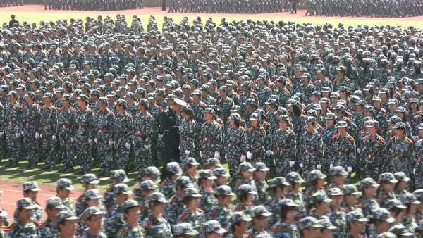 Chinese students march during a military performance, to celebrate the ...