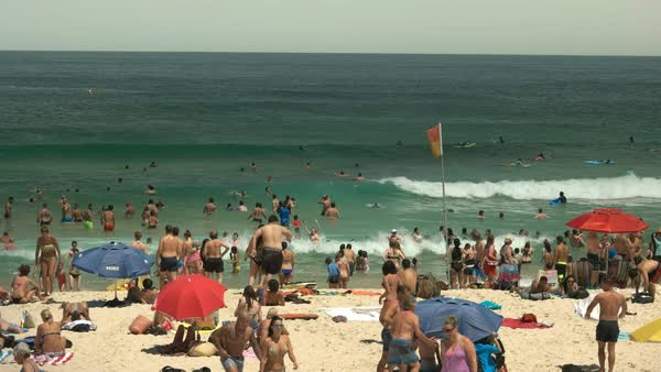 Swimmers and beach goers at bondi beach, australia's most famous beach ...