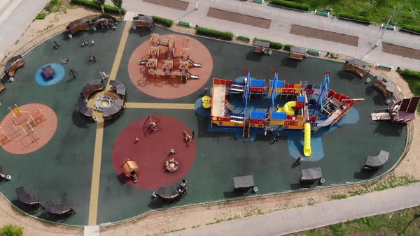 Aerial view of children playground on yard activities in public park ...