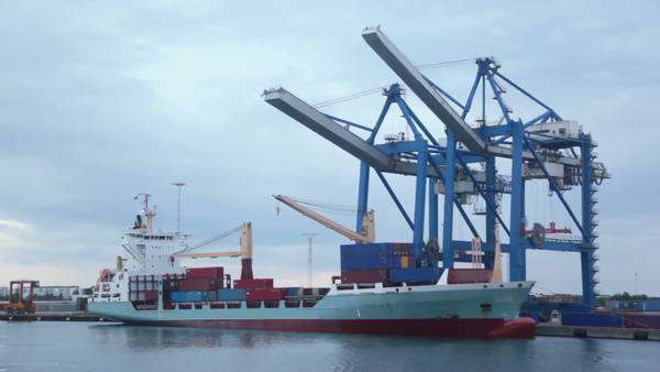Crane prepares for embarkation of barge in dock at Copenhagen - Stock ...