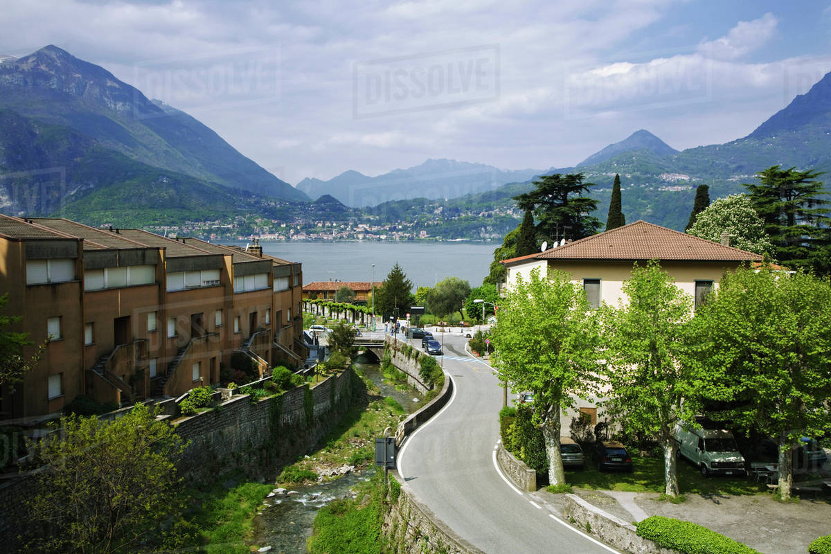Italy, Lake Como. Road leads to the town of Varenna on the shores of ...
