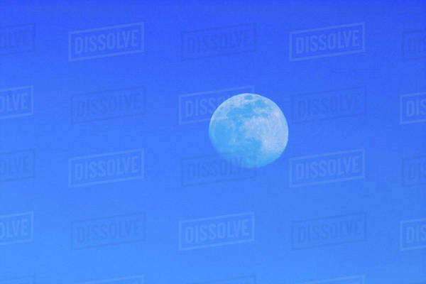 Full moon in blue sky. - Royalty-free Stock Photo | Dissolve