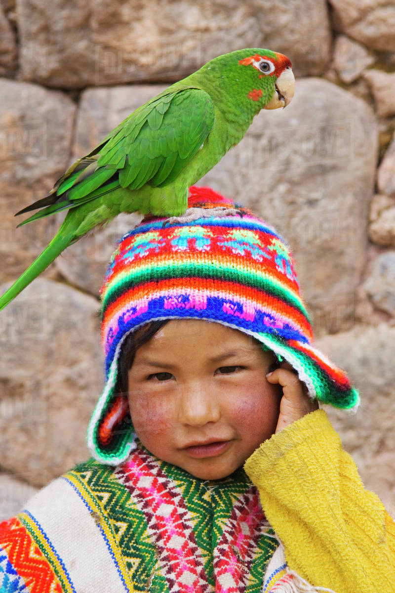 Peru, Cusco, Sacsayhuaman Inca ruins, Portrait of young boy in native ...