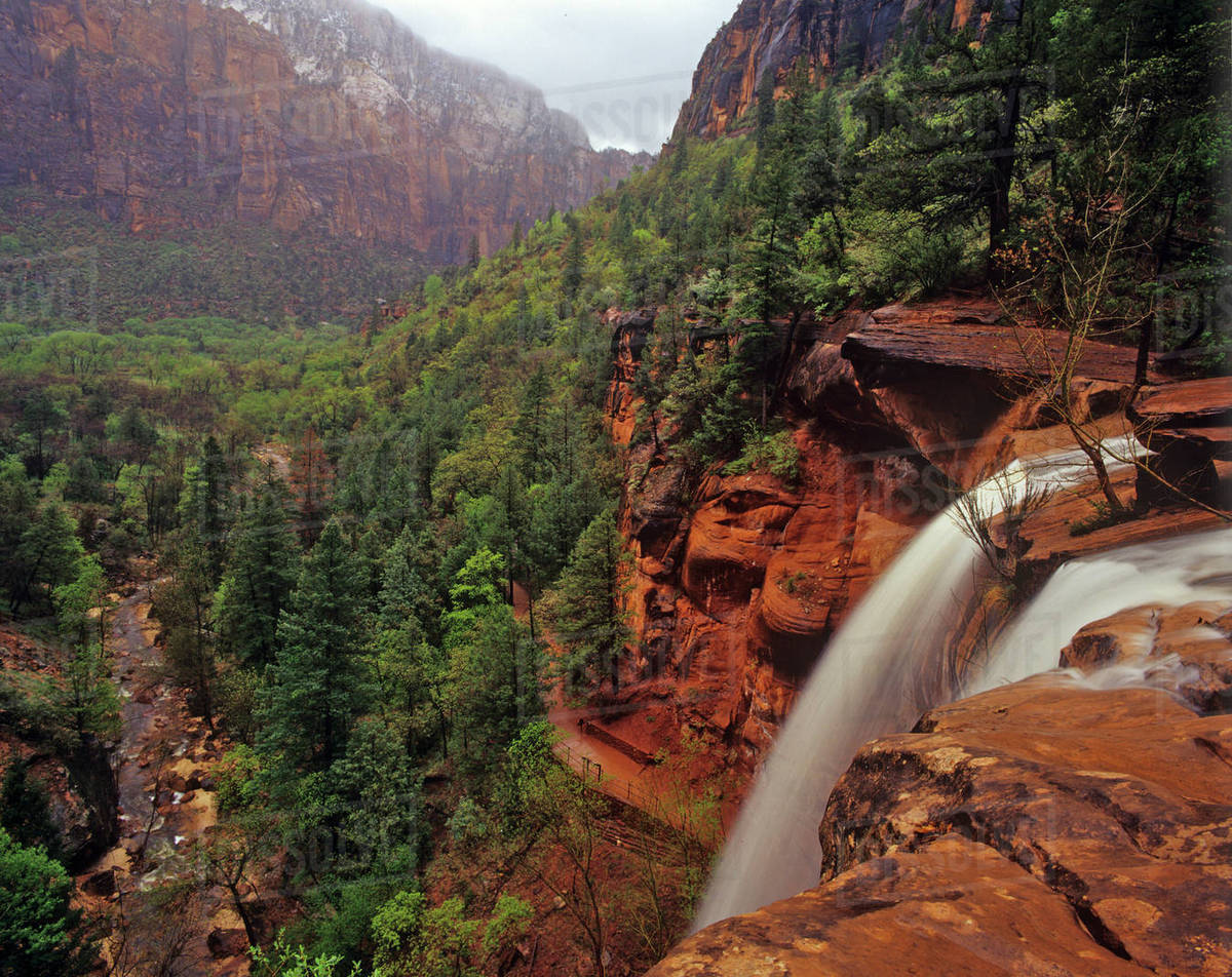 Waterfall along the Emerald Pools Trail in Zion National Park, Utah, USA - Stock Photo - Dissolve