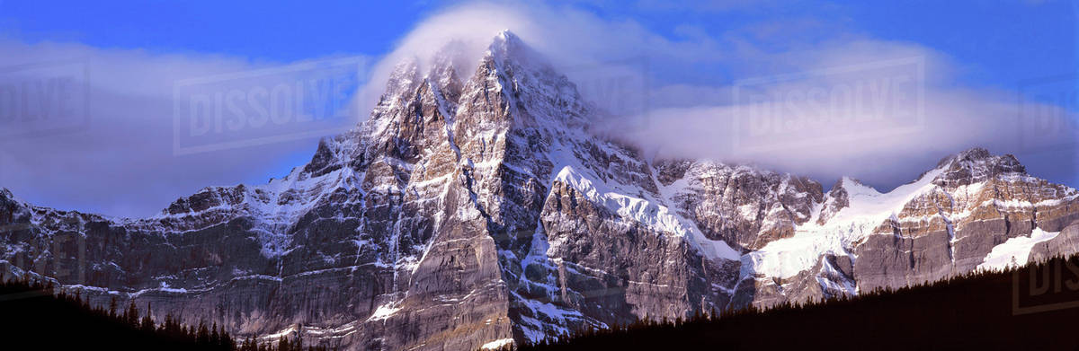 Canada, Alberta, Mt. Chephren. Mount Chephren wears a mantle of clouds ...