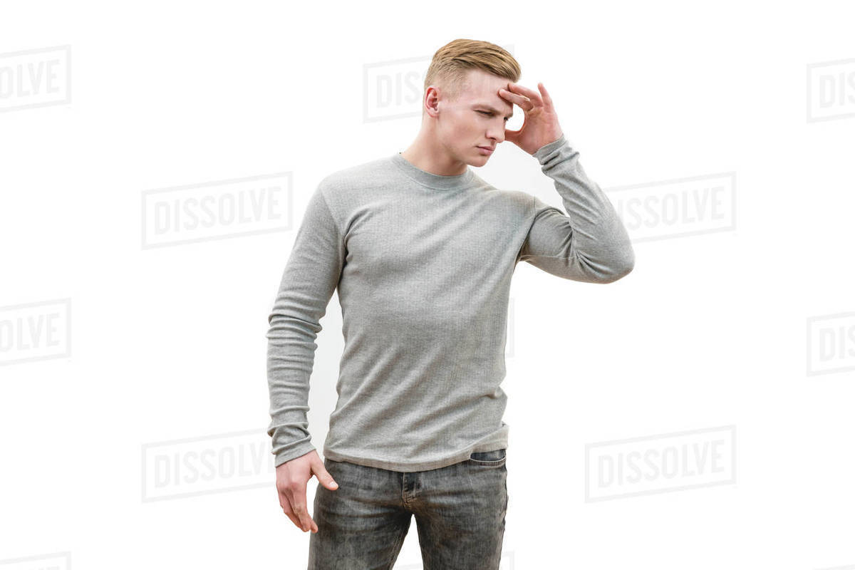 The sad man standing on the white background - Stock Photo - Dissolve