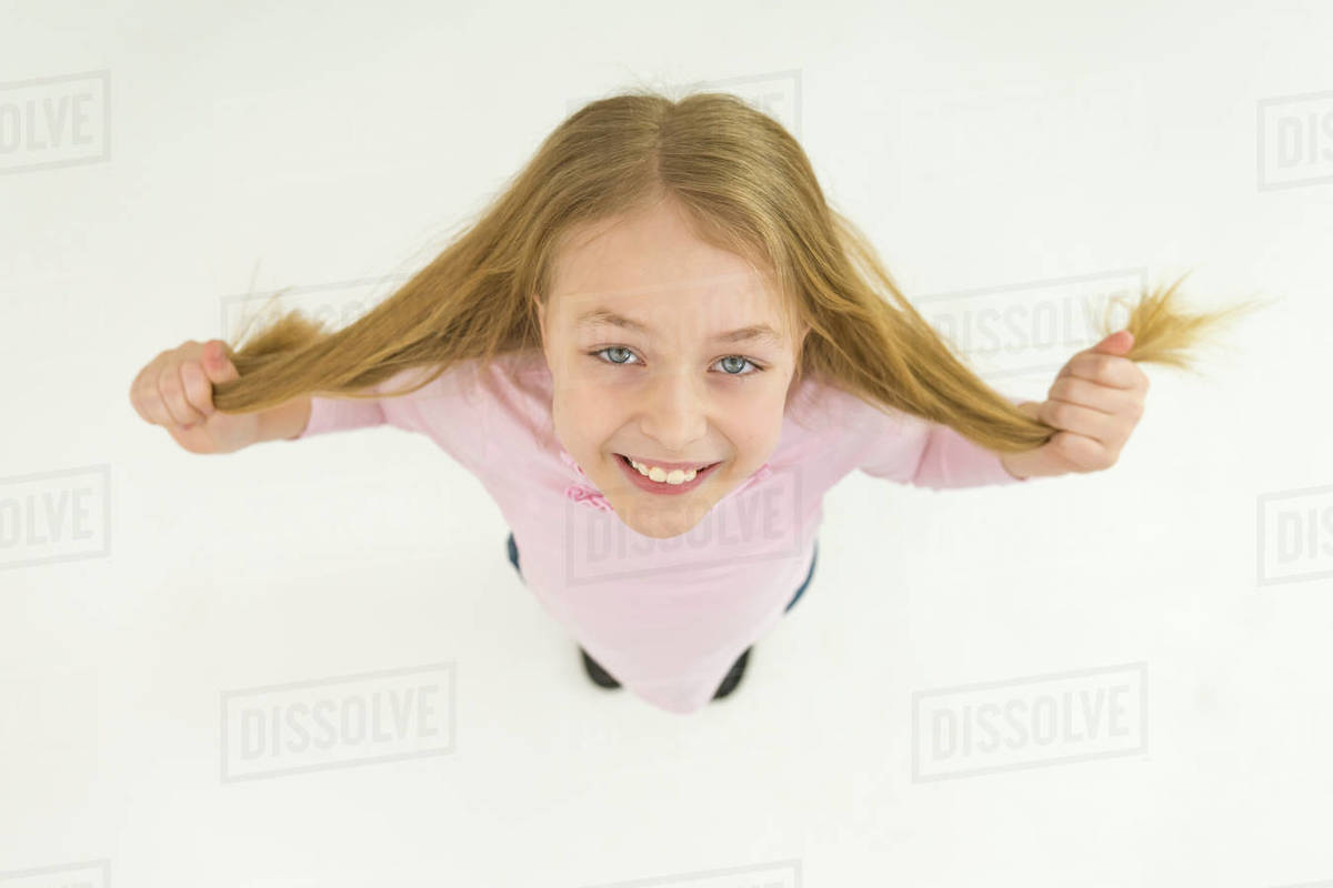 The smile girl touch her hair. View from above - Royalty-free Stock ...