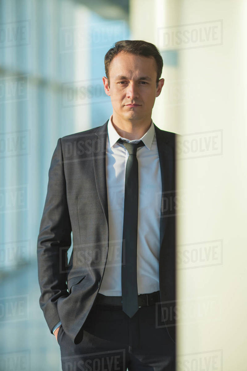 The businessman stand near the column - Royalty-free Stock Photo | Dissolve