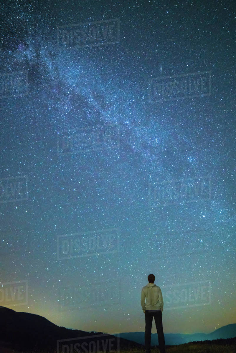The man stand and look to the starry sky. night time - Royalty-free ...