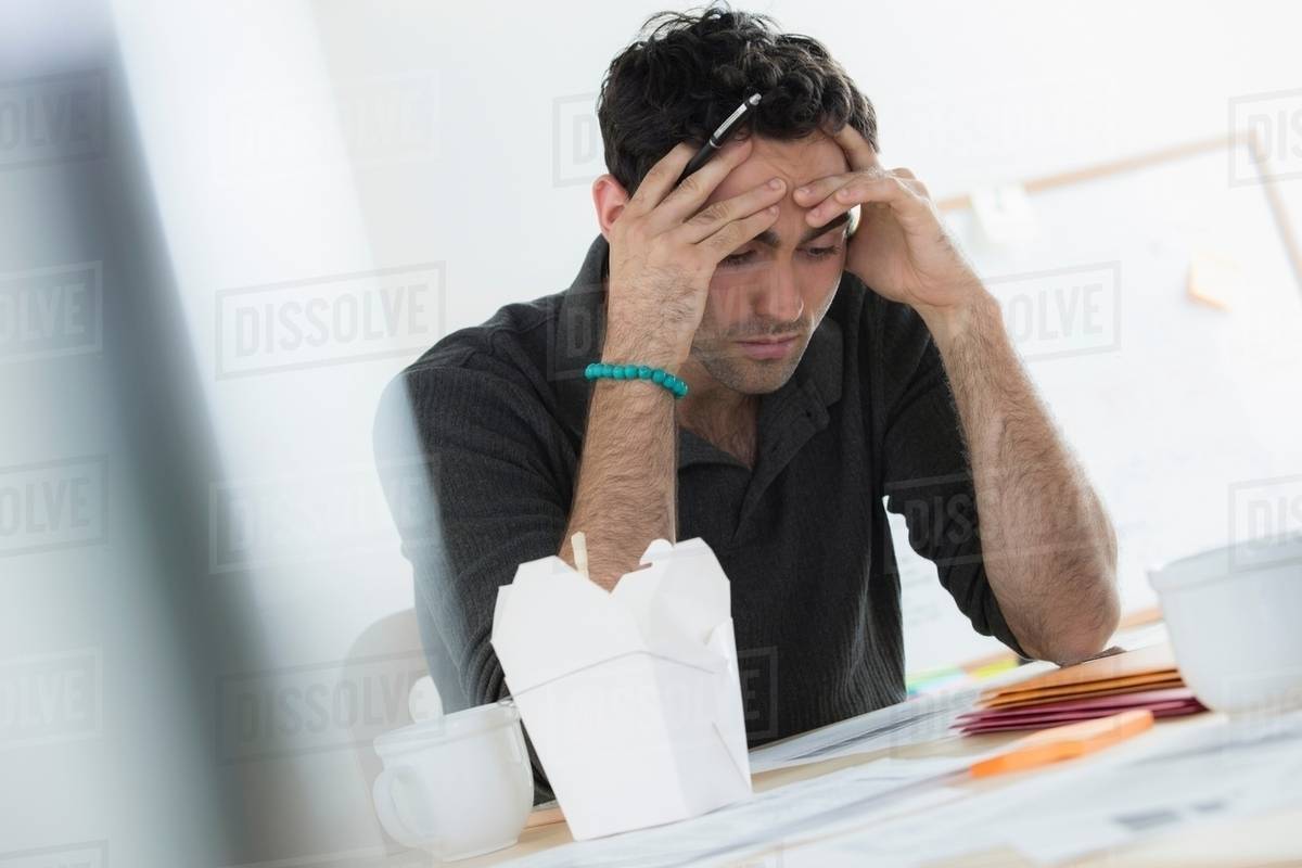 Portrait of male office worker with hands on head - Royalty-free Stock ...