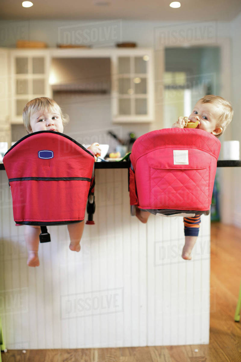 Rear view portrait of male and female toddlers looking back from ...