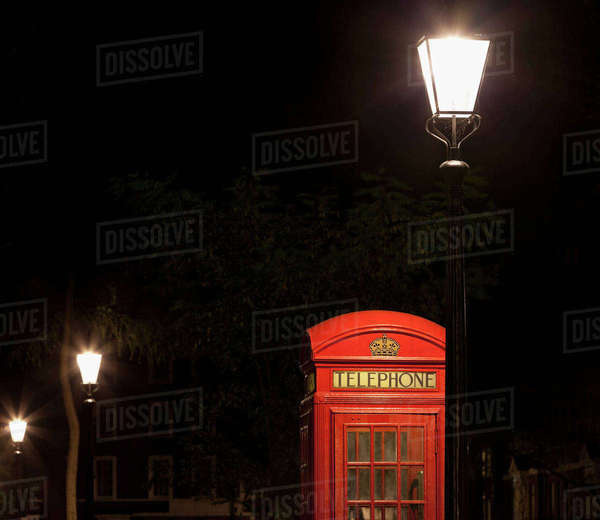 Red telephone box on city street - Royalty-free Stock Photo | Dissolve