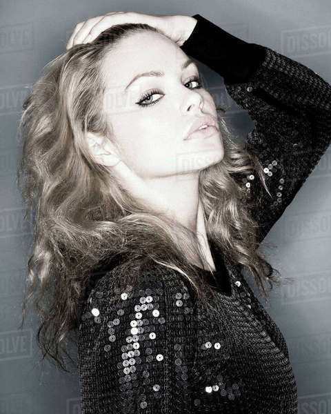 Woman pushing her hair back - Royalty-free Stock Photo | Dissolve