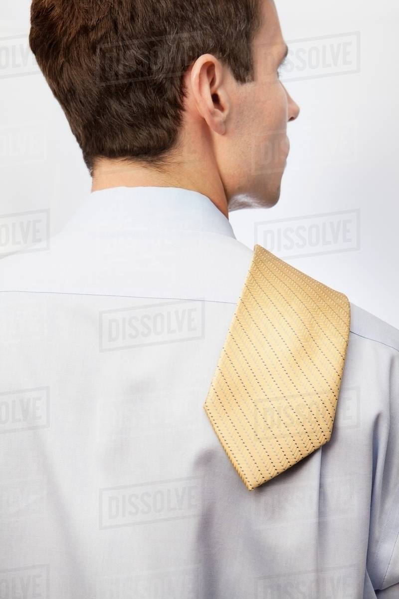 Young man with tie over shoulder - Royalty-free Stock Photo | Dissolve