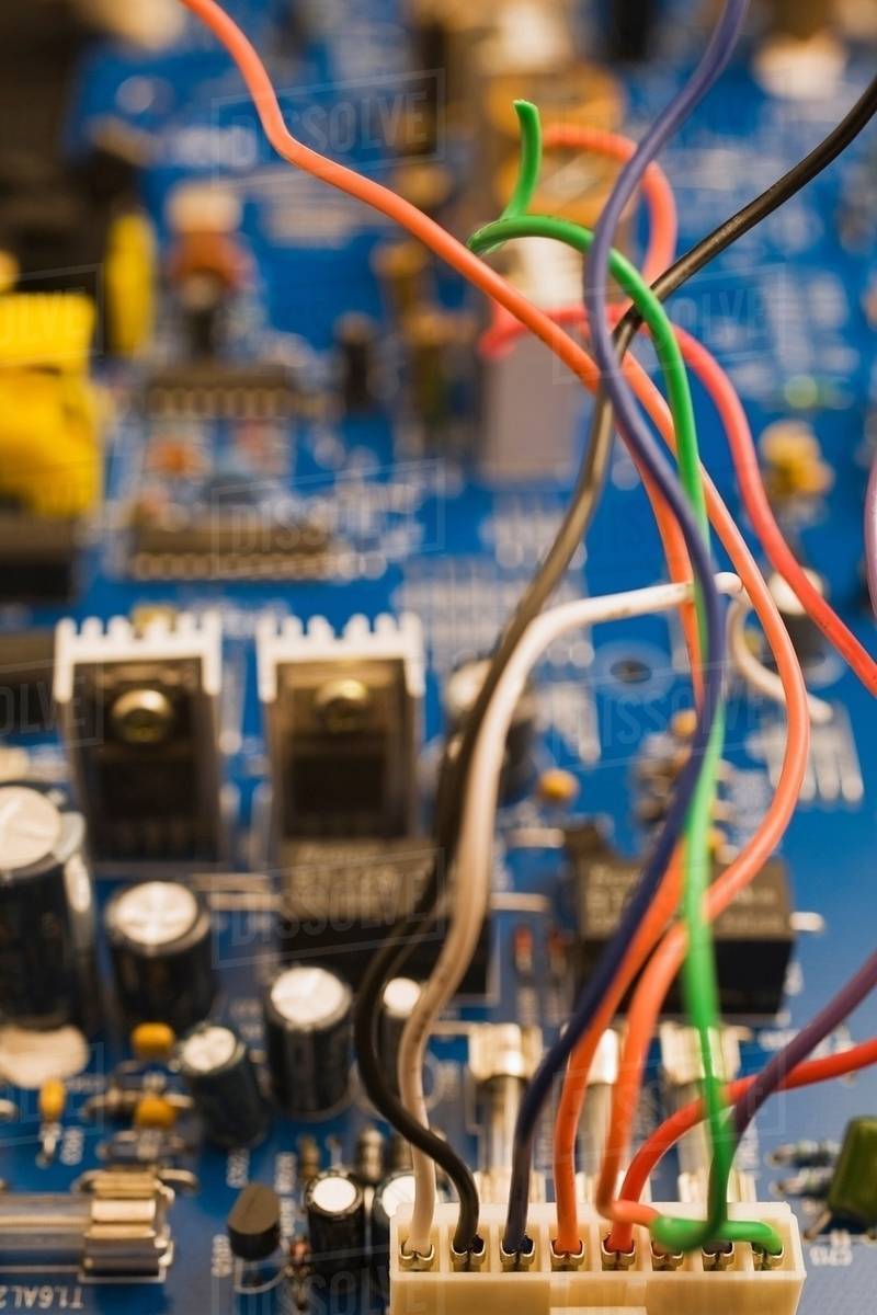 Close up of electical wires and circuit board - Stock Photo - Dissolve