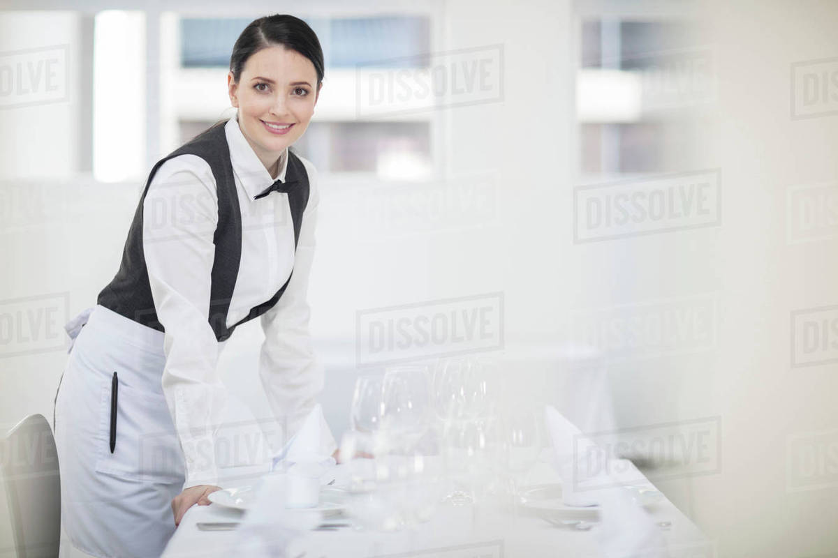 Portrait of waitress in restaurant - Stock Photo - Dissolve