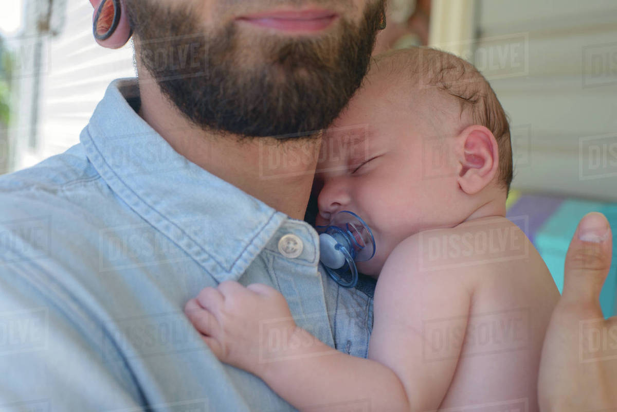 Man with sleeping baby boy on shoulder - Royalty-free Stock Photo ...