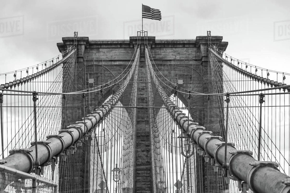 View of American flag on Brooklyn Bridge, B&W, New York, USA - Royalty ...
