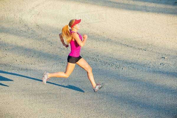 Teenage girl running - Stock Photo - Dissolve