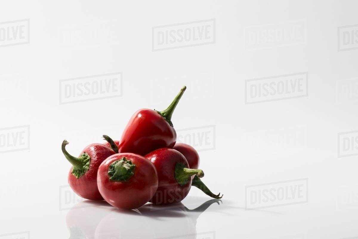 Pile of small red peppers - Stock Photo - Dissolve
