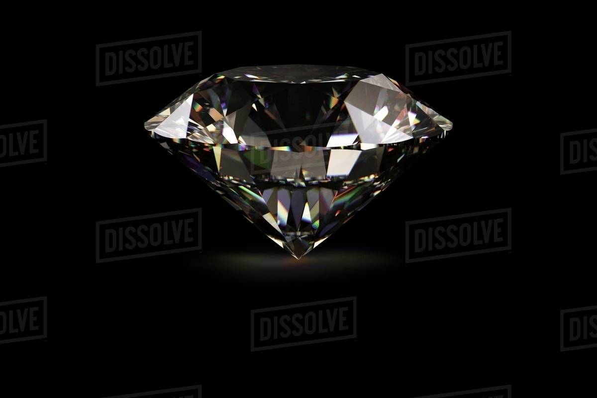 Diamond against black background - Stock Photo - Dissolve