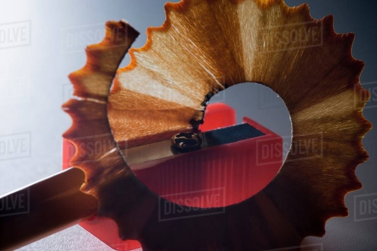 Pencil being sharpened with pencil sharpener - Stock Photo - Dissolve