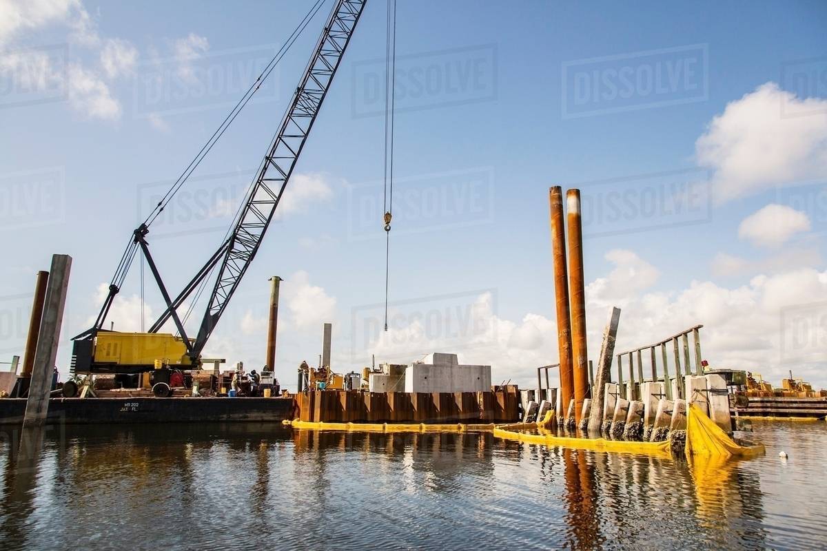 Crane at construction site on water - Royalty-free Stock Photo | Dissolve