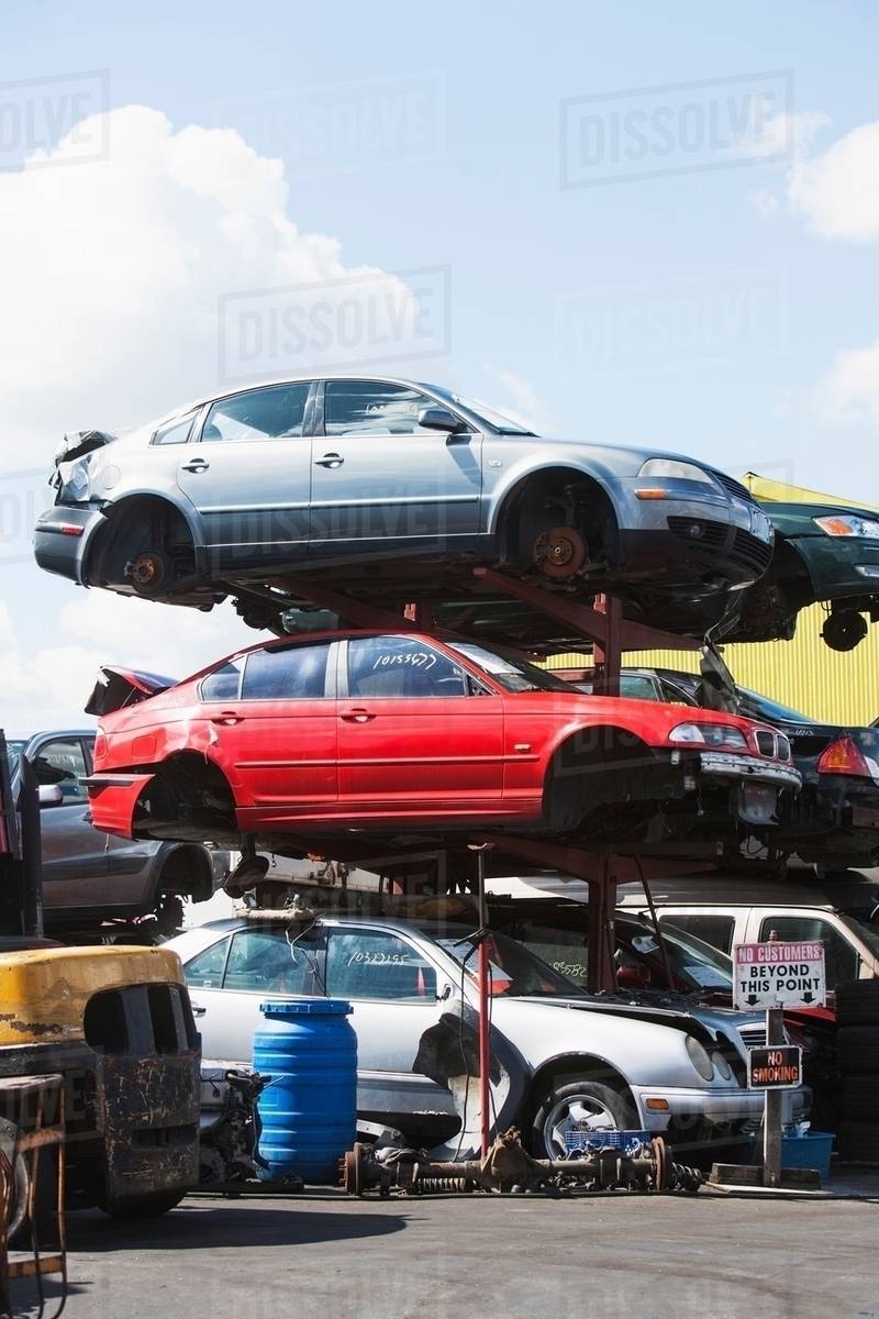 Cars stacked in scrap yard - Royalty-free Stock Photo | Dissolve