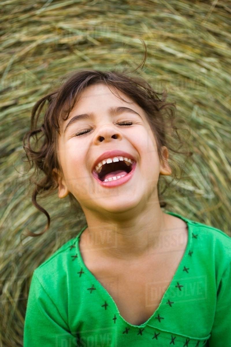Portrait of a girl laughing - Stock Photo - Dissolve