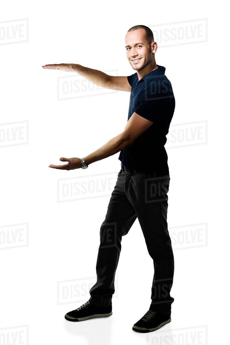 Young man gesturing - Royalty-free Stock Photo | Dissolve