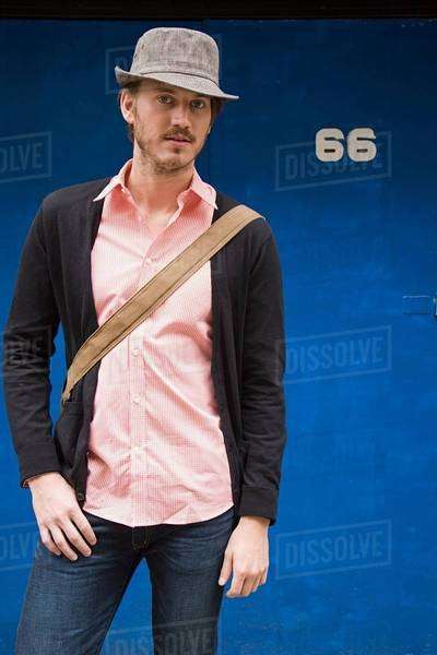 Man wearing fedora - Stock Photo - Dissolve