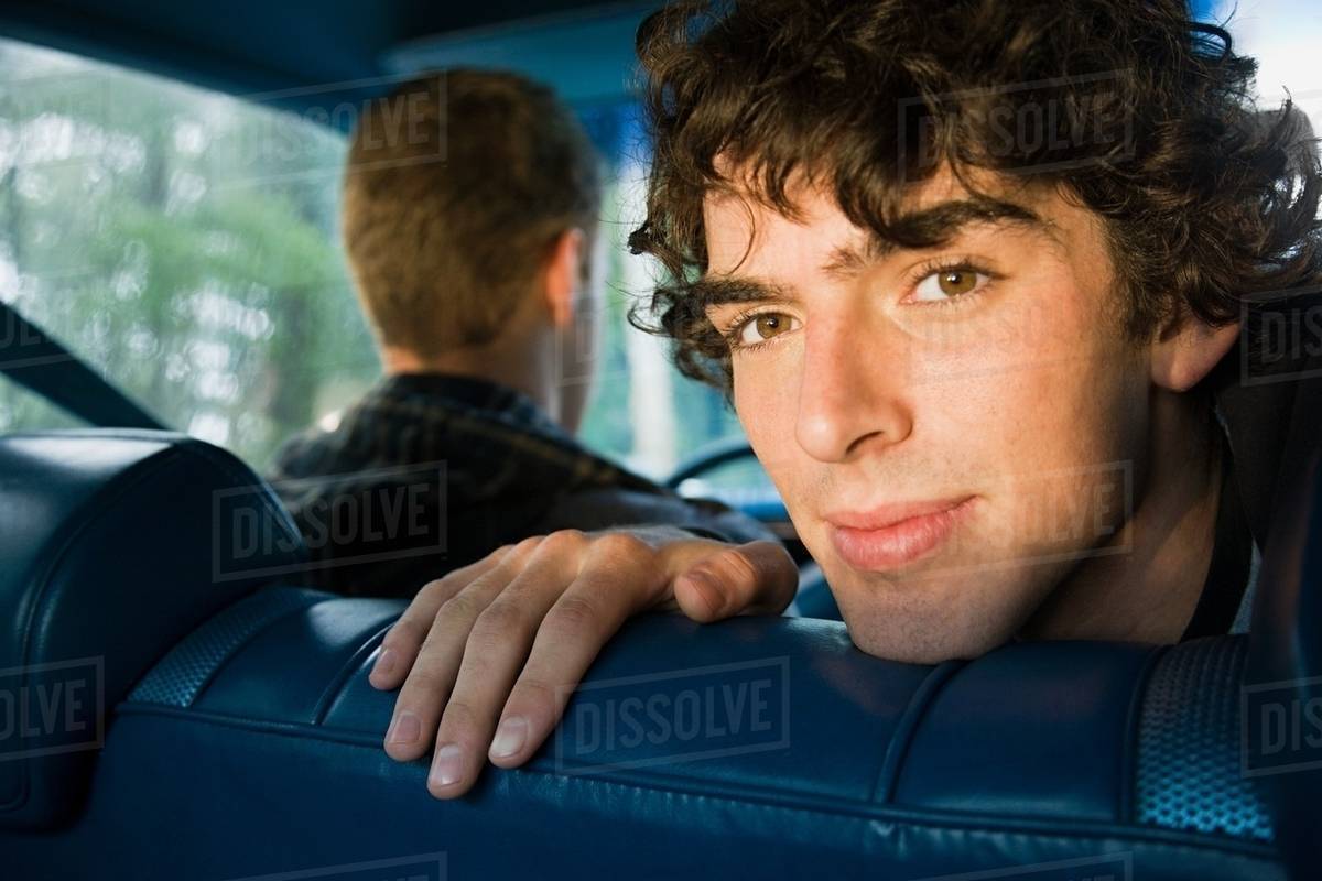 Young man in car - Stock Photo - Dissolve