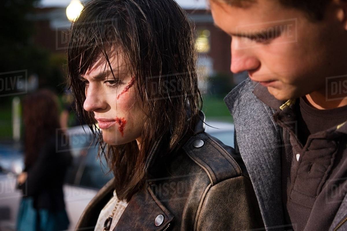 Young couple involved in road accident - Stock Photo - Dissolve