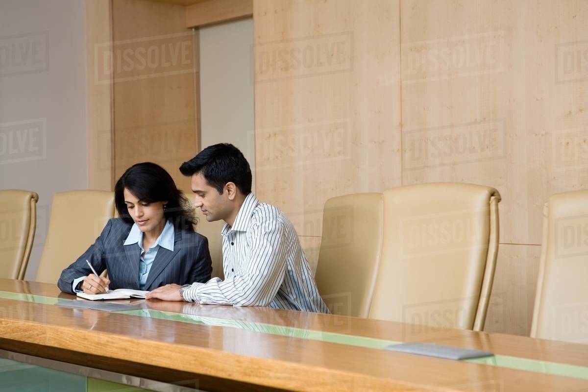 Indian colleagues in an office - Stock Photo - Dissolve