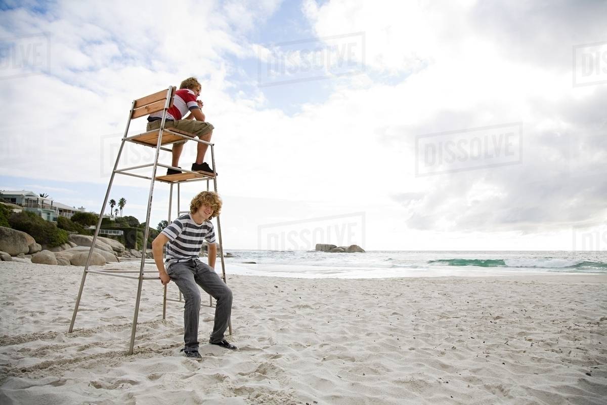 Two boys on lifeguard tower - Royalty-free Stock Photo | Dissolve