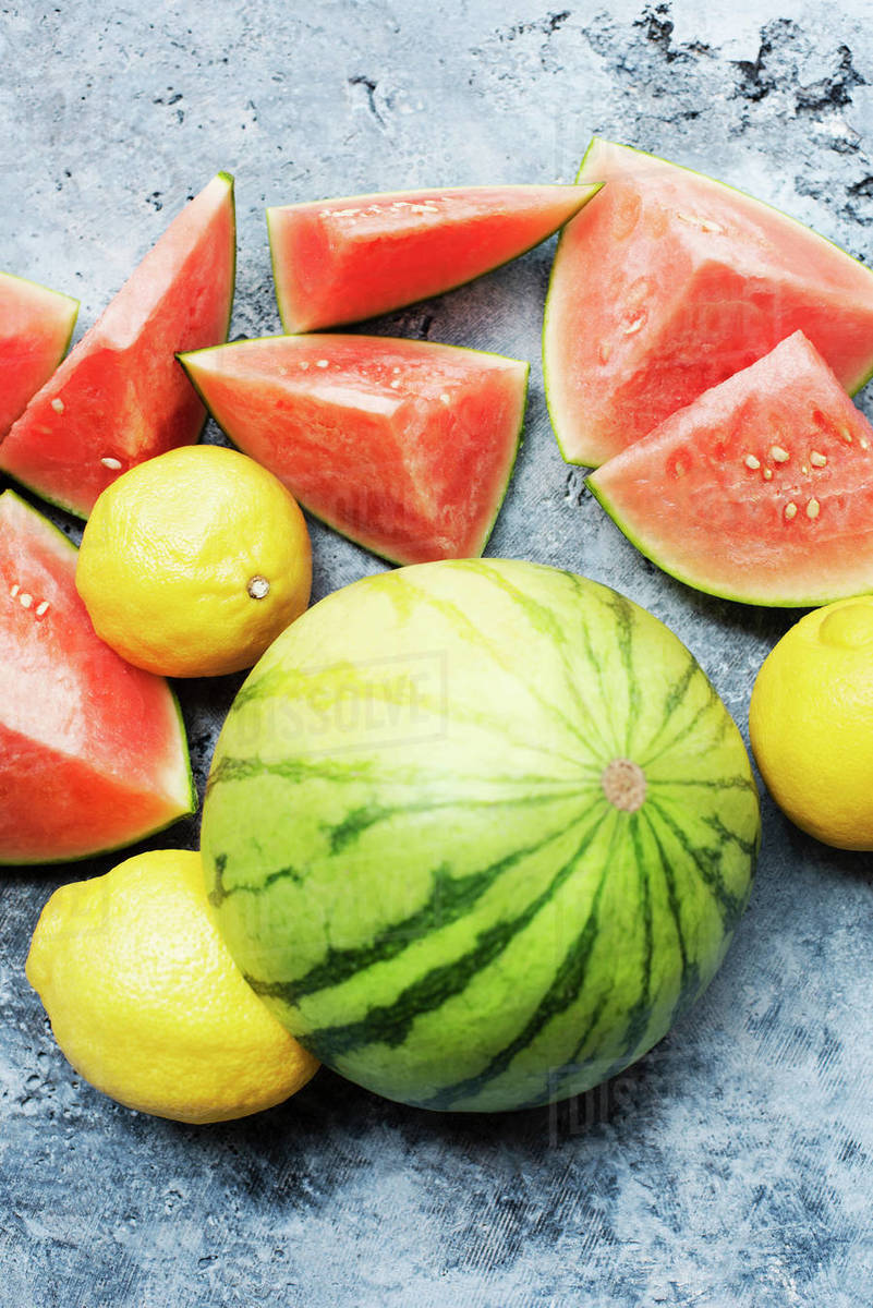 Overhead view of watermelon and lemons - Stock Photo - Dissolve