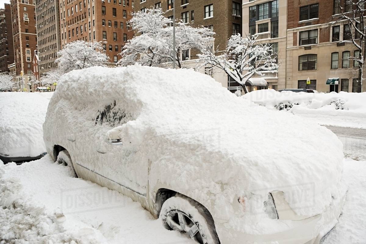 Car covered in snow - Royalty-free Stock Photo | Dissolve